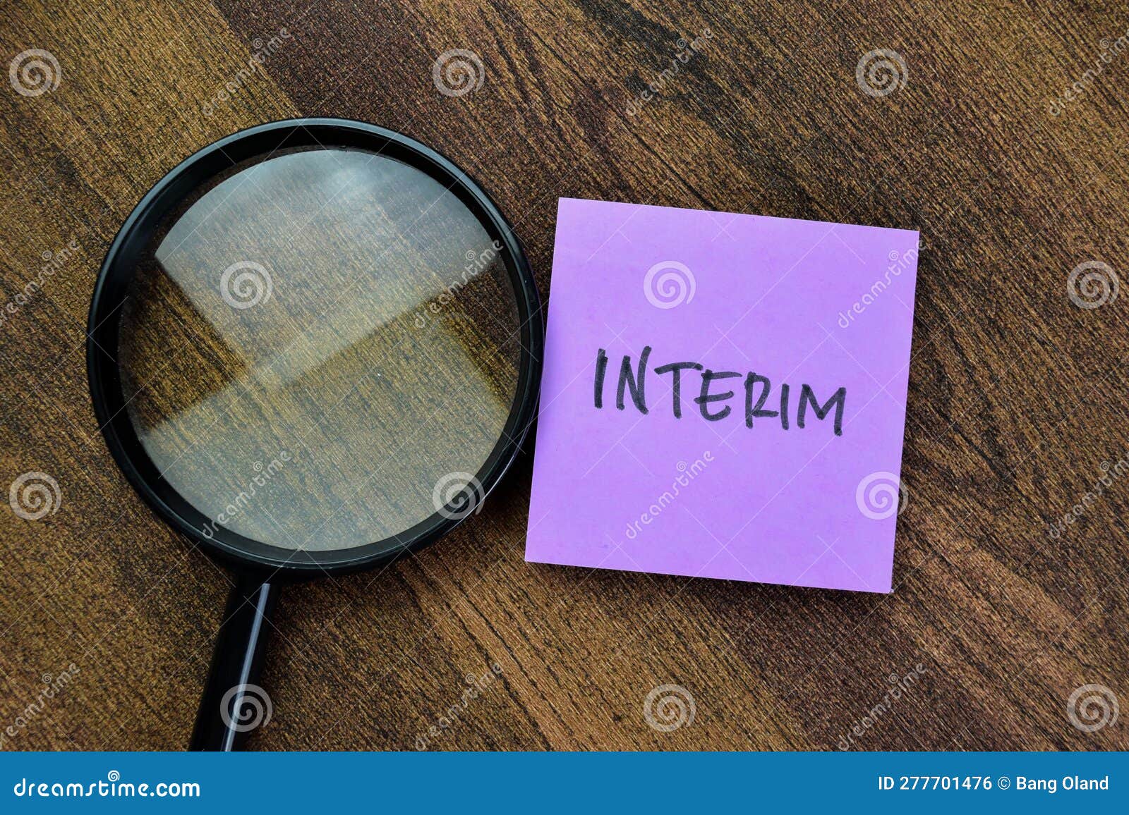 Concept of Interim Write on Sticky Notes Isolated on Wooden Table Stock ...