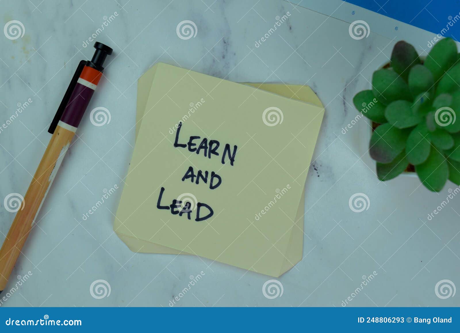 Concept of Learn and Lead Write on Sticky Notes Isolated on Wooden ...