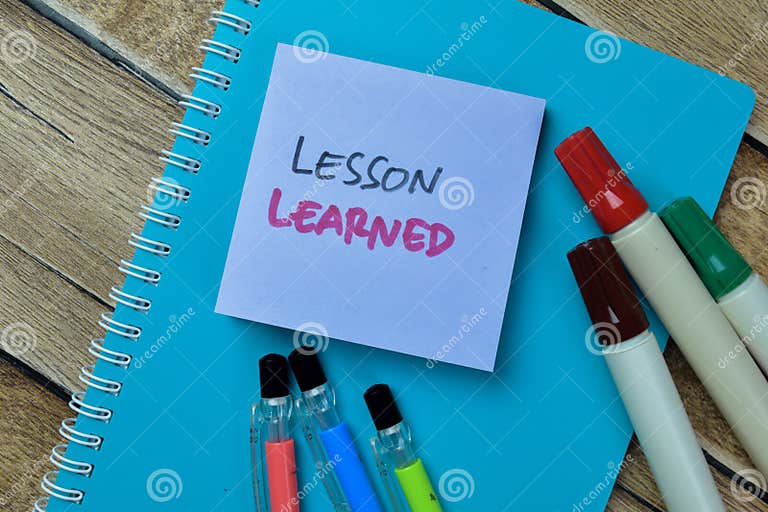 Concept of Lesson Learned Write on Sticky Notes Isolated on Wooden ...