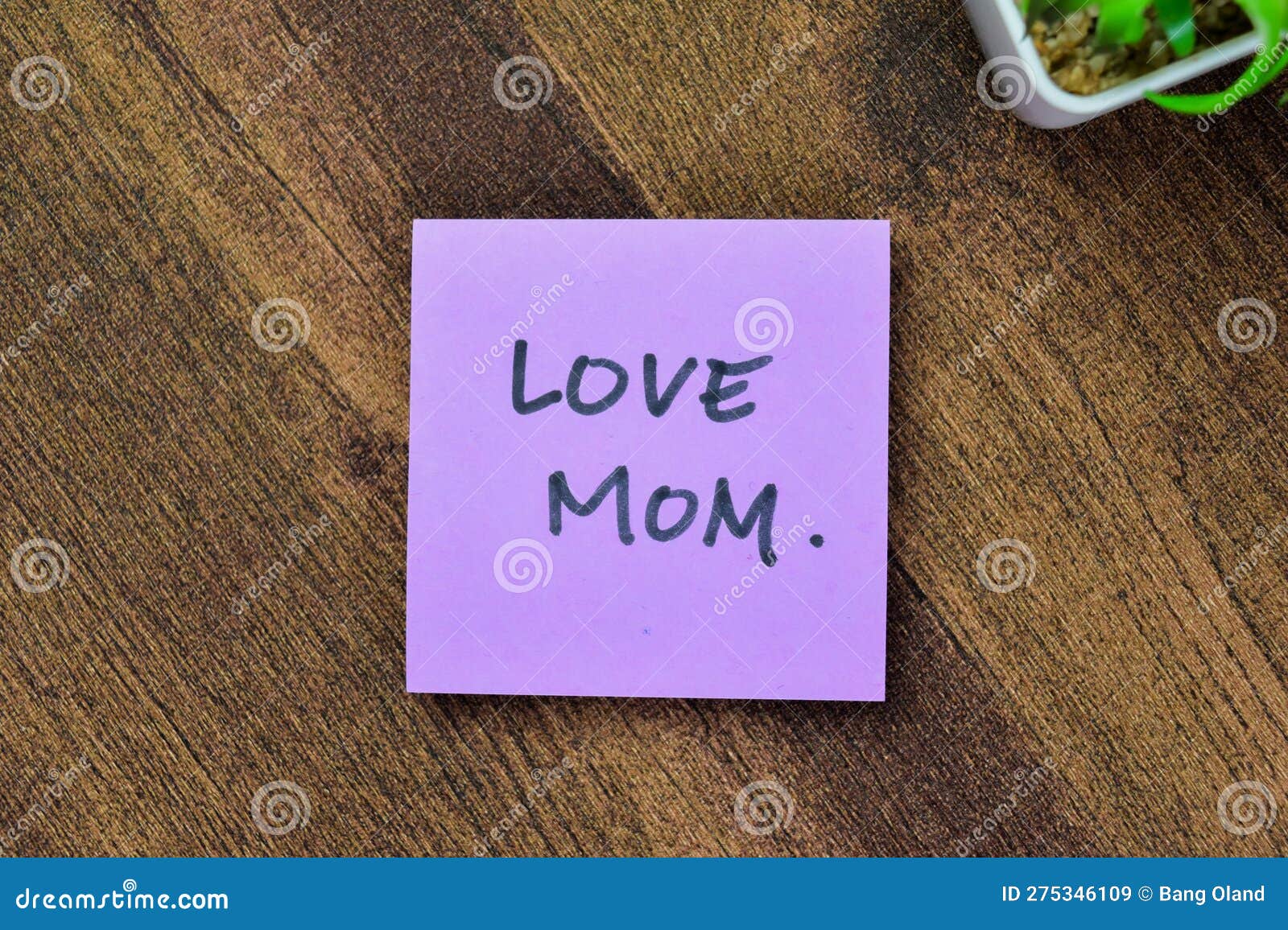 Concept of Love Mom Write on Sticky Notes Isolated on Wooden Table ...