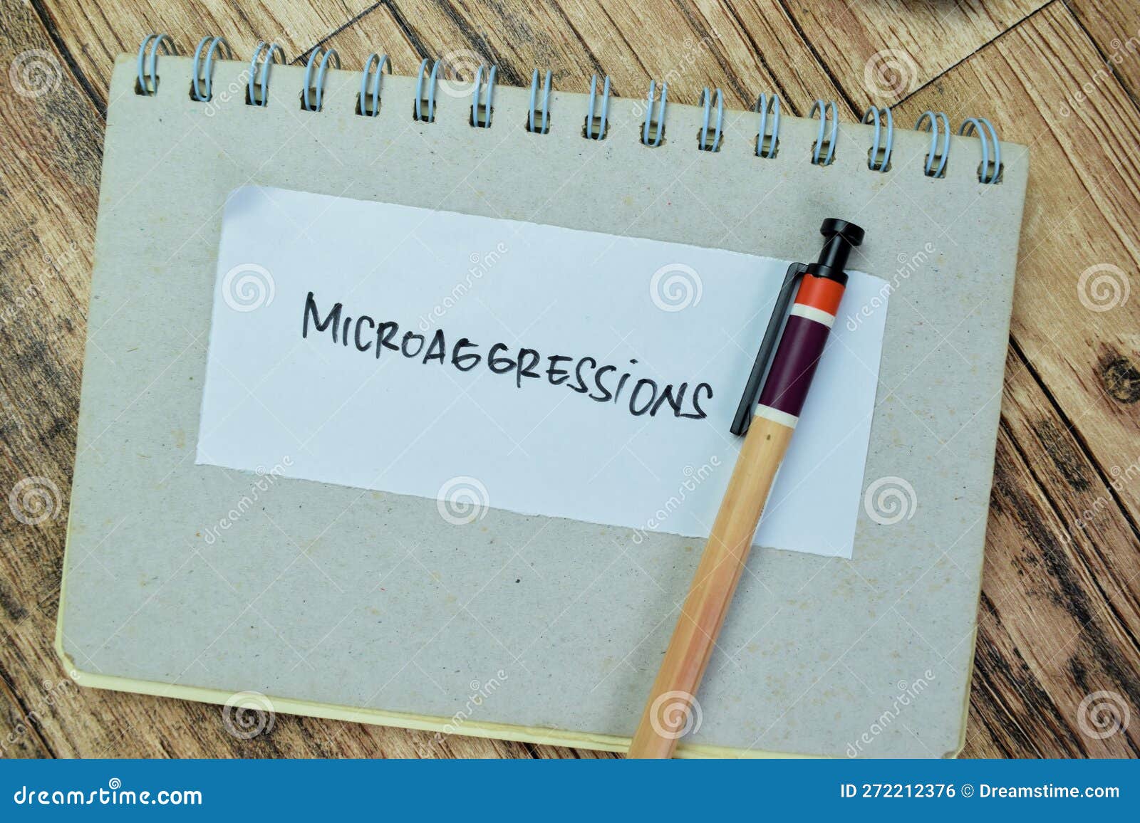 Concept Of Microaggressions Write On Sticky Notes Isolated On Wooden