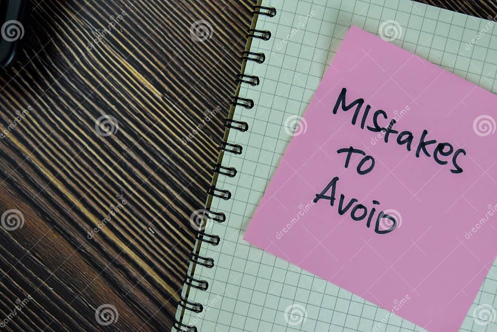 Concept of Mistakes To Avoid Write on Sticky Notes Isolated on Wooden ...