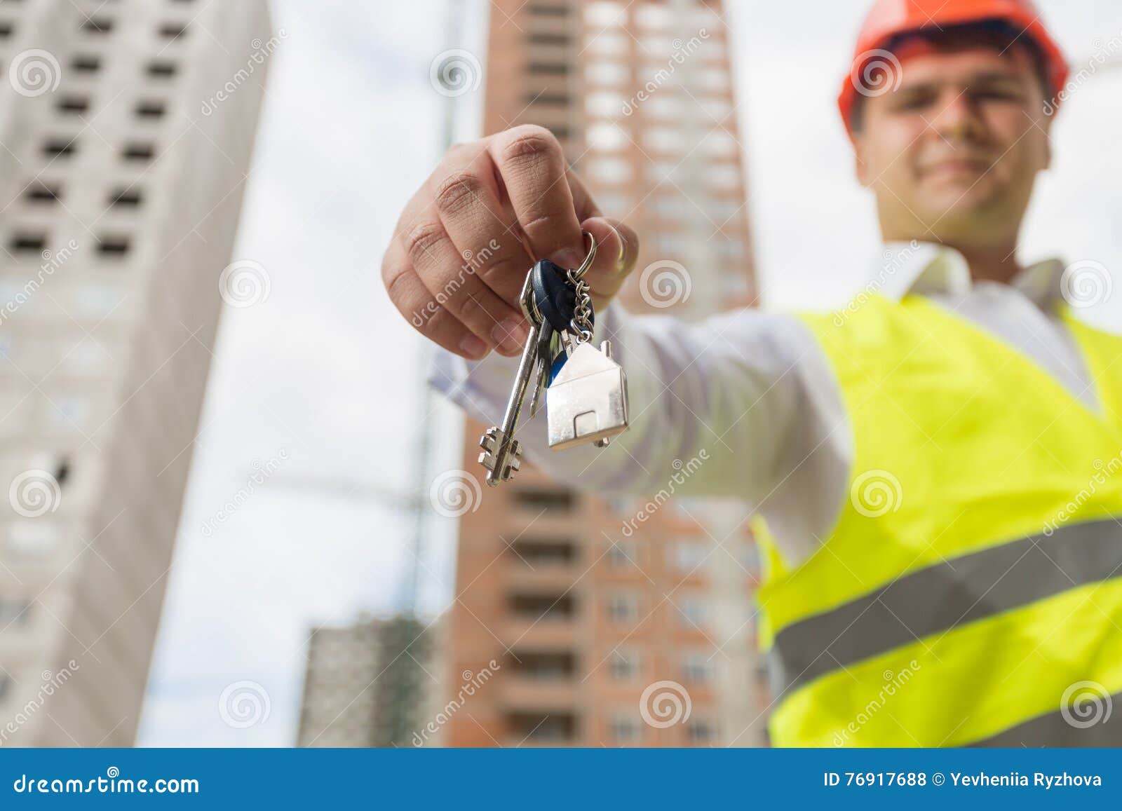 Concept of New Home. Engineer on Building Site Showing Key from Stock ...