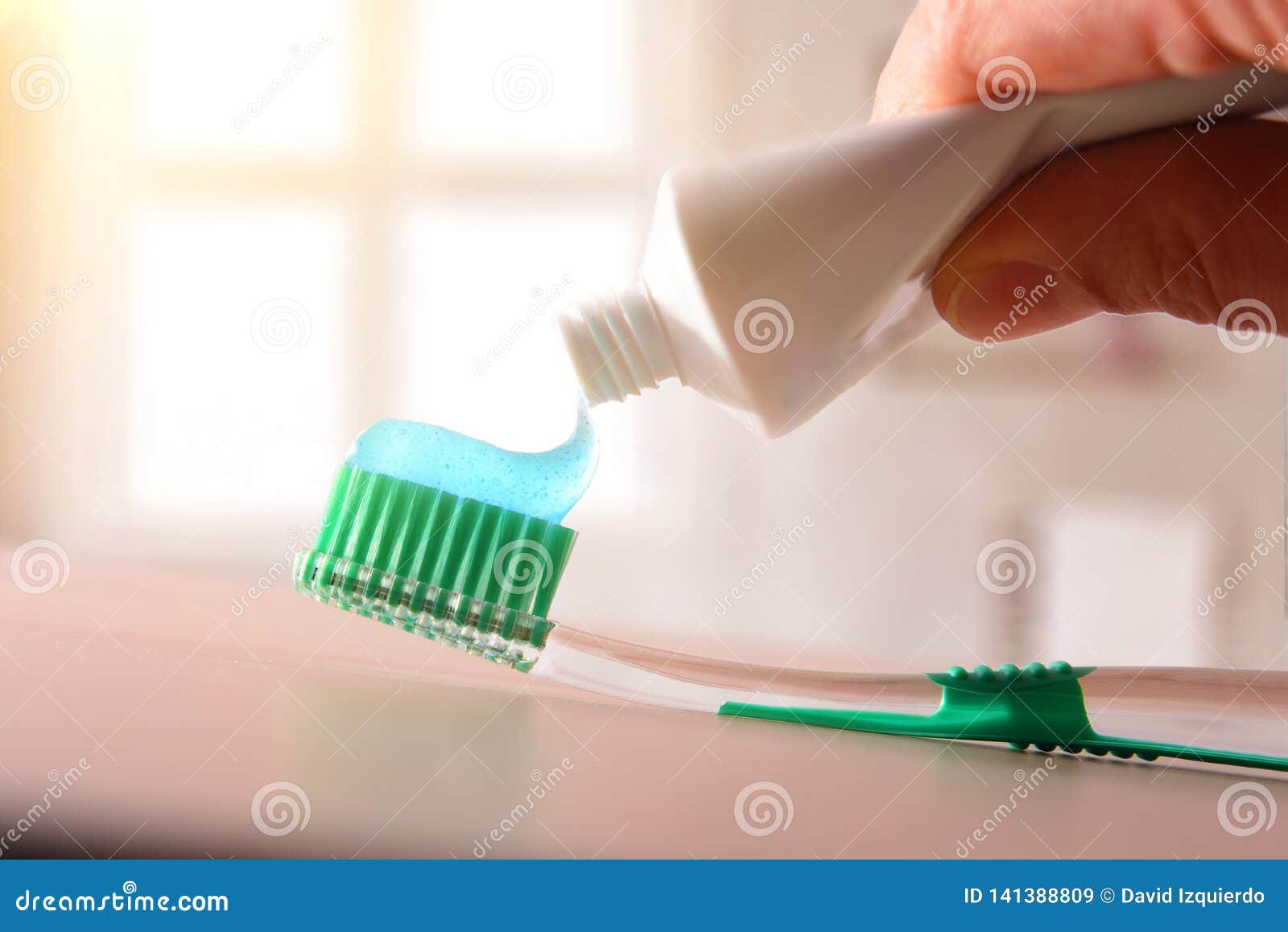 Putting Toothpaste On Toothbrush