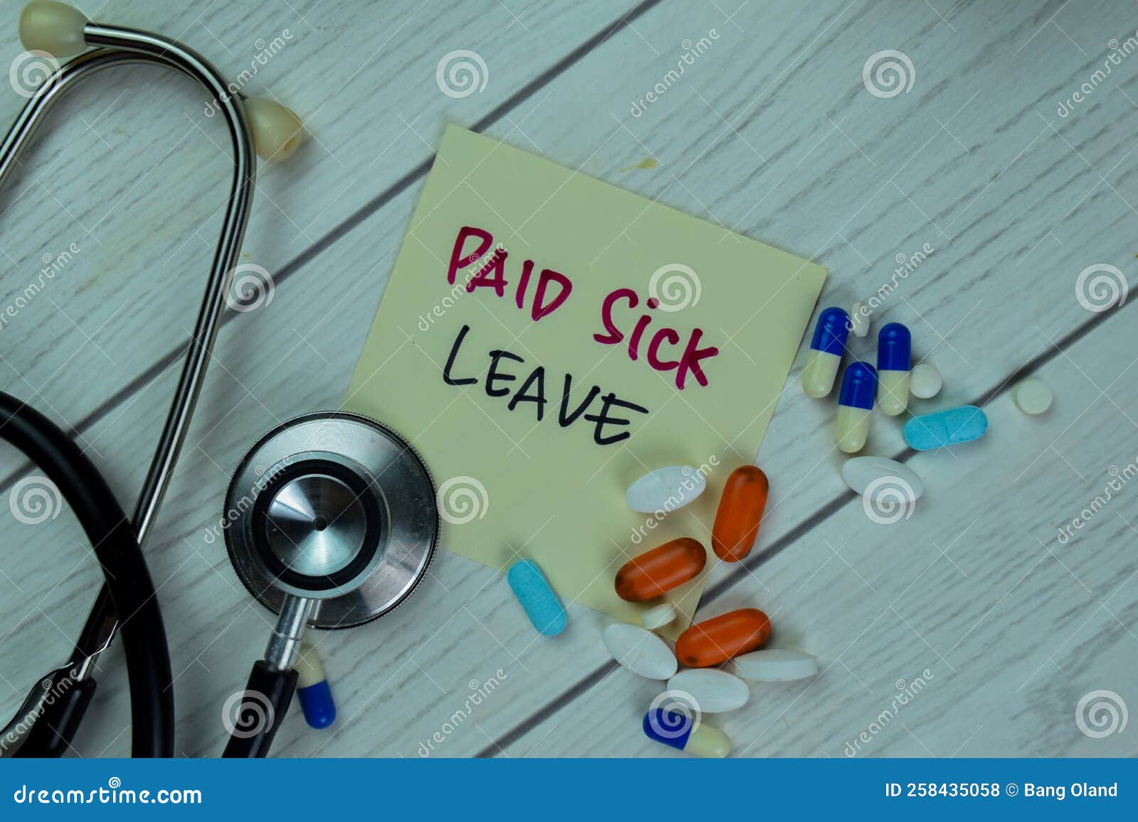 Concept of Paid Sick Leave Write on Sticky Notes Isolated on Wooden ...