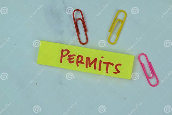 Concept of Permits Write on Sticky Notes Isolated on Wooden Table Stock ...