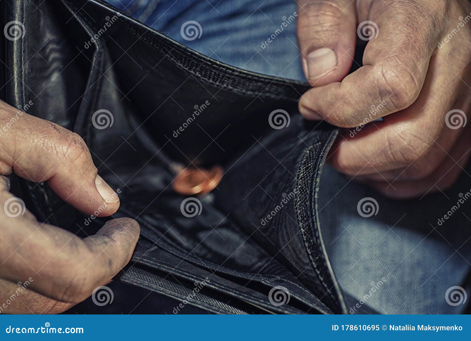 The Dirty Hands of a Man Holding an Empty Wallet with One Coin. the ... The Dirty Hands of a Man Holding an Empty Wallet with One Coin. the ...