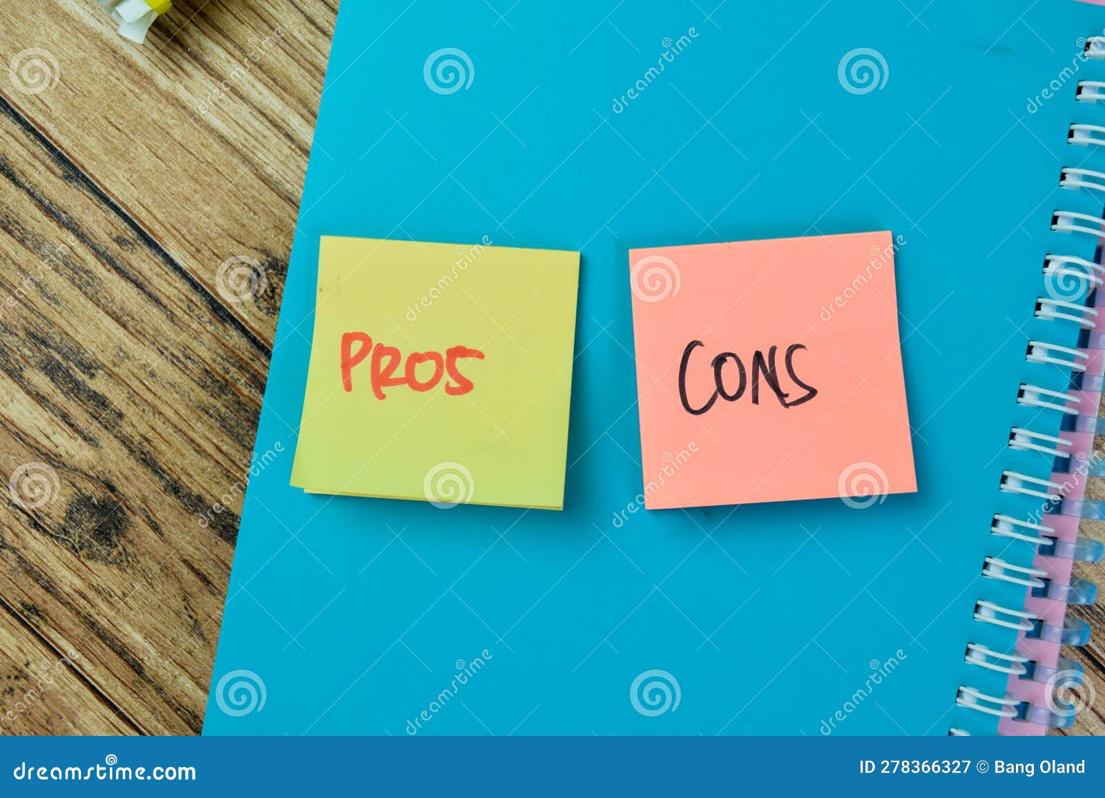 Concept of Pros or Cons Write on Sticky Notes Isolated on Wooden Table ...