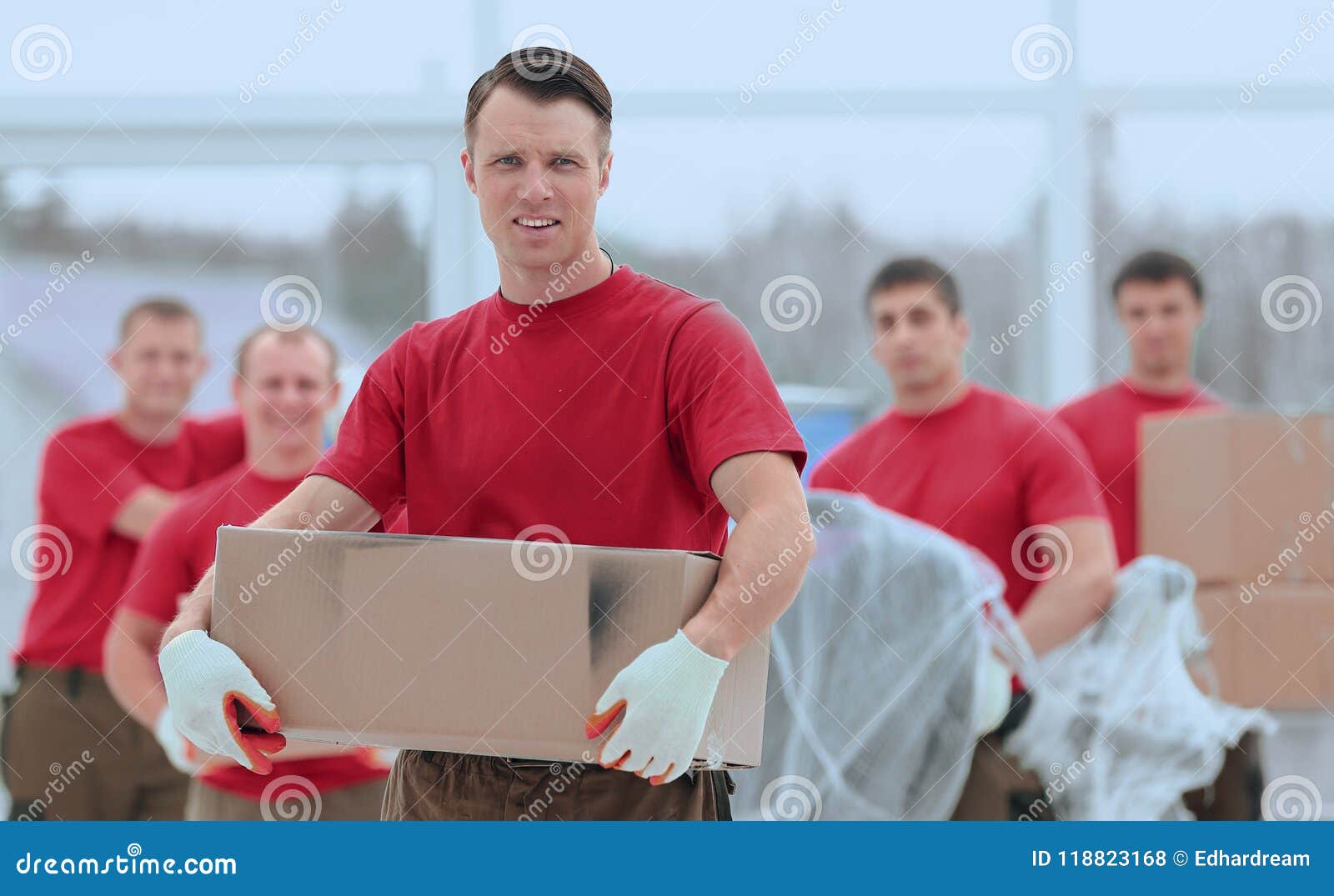 Foreman and Workers with Boxes of Building Materials Stock Photo ...