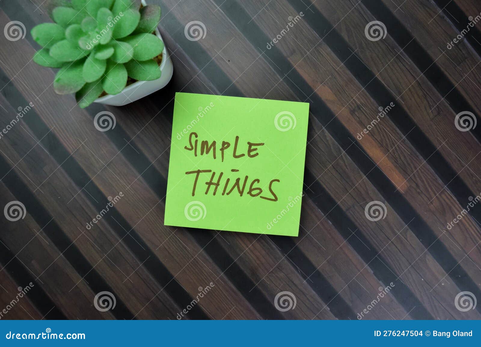 Concept Of Simple Things Write On Sticky Notes Isolated On Wooden Table