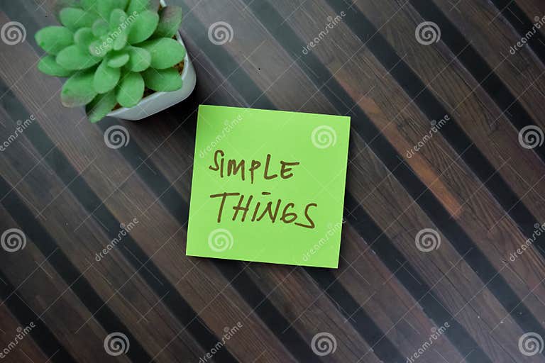 Concept of Simple Things Write on Sticky Notes Isolated on Wooden Table ...