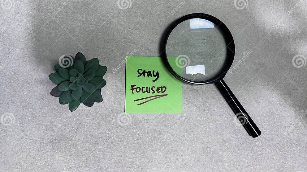 Concept of Stay Focused Write on Sticky Notes Isolated on Wooden Table ...
