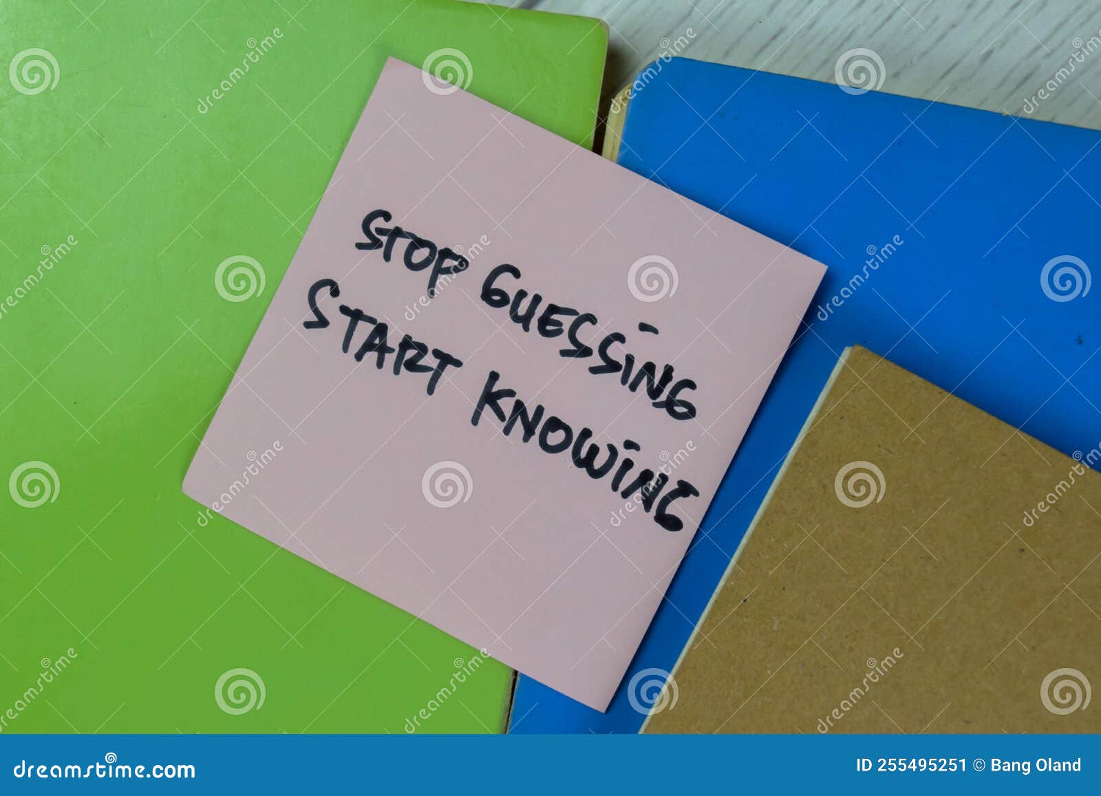 Concept of Stop Guessing, Start Knowing Write on a Book Isolated on Wooden Table Stock Image ...