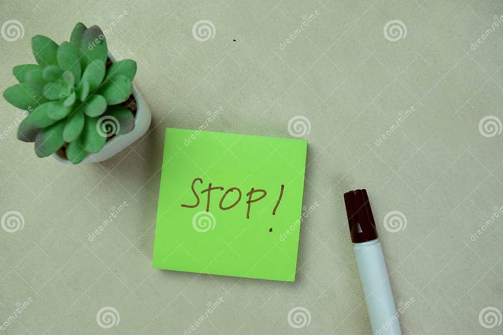 Concept of Stop! Write on Sticky Notes Isolated on Wooden Table Stock ...