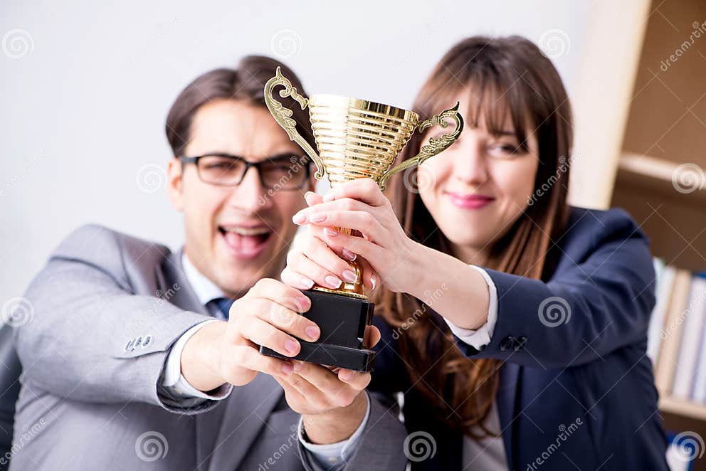 The Concept of Teamwork with Prize Stock Photo - Image of excitement ...