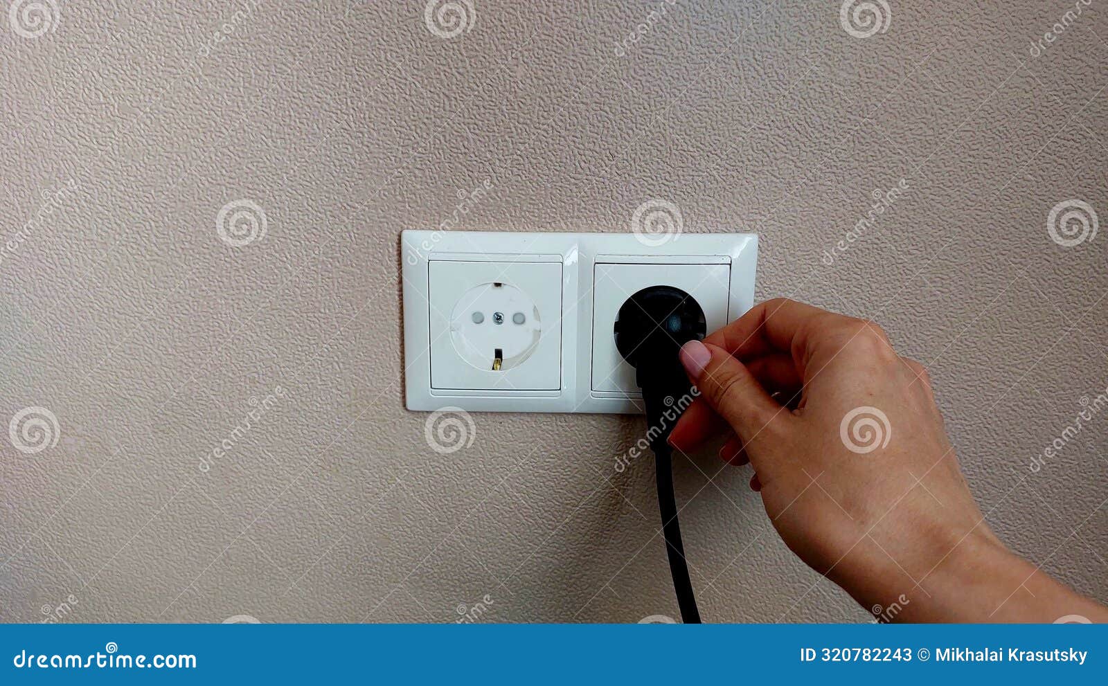 Concept of Unplugging or Plugging into Wall Electrical Socket Close ...