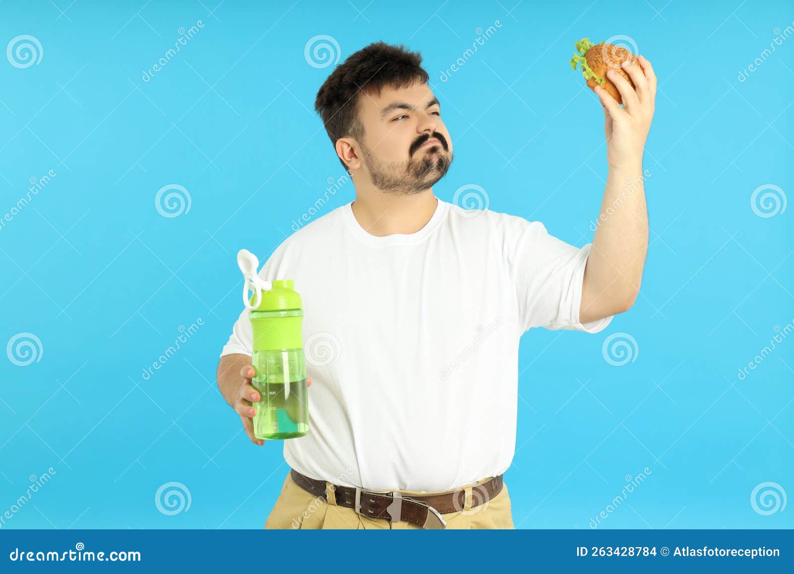 Concept of Weight Problems, Young Fat Man on Blue Background Stock ...