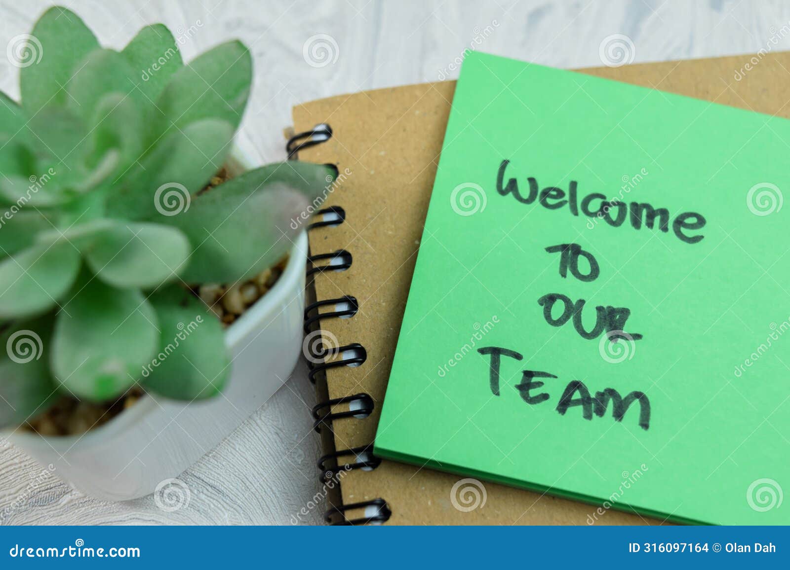 Concept of Welcome To Our Team Write on Sticky Notes Isolated on Wooden ...