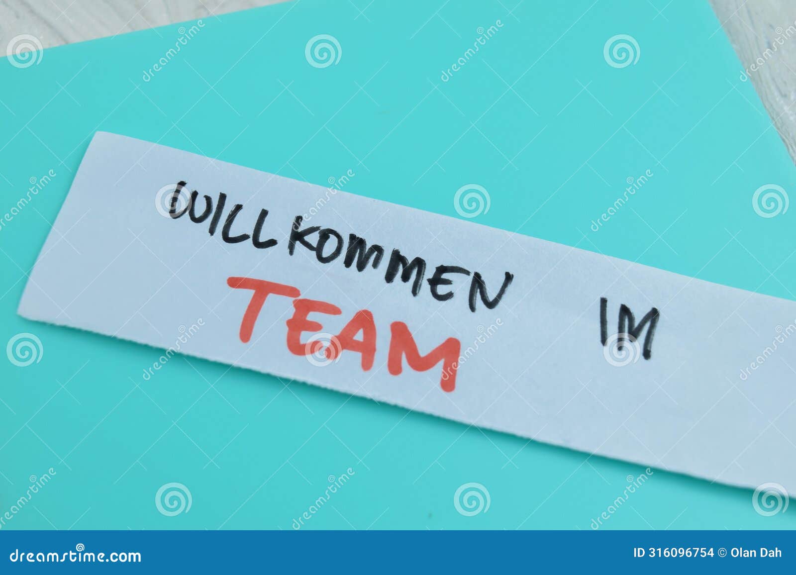 Concept of Willkommen Im Team Write on Sticky Notes Isolated on Wooden ...