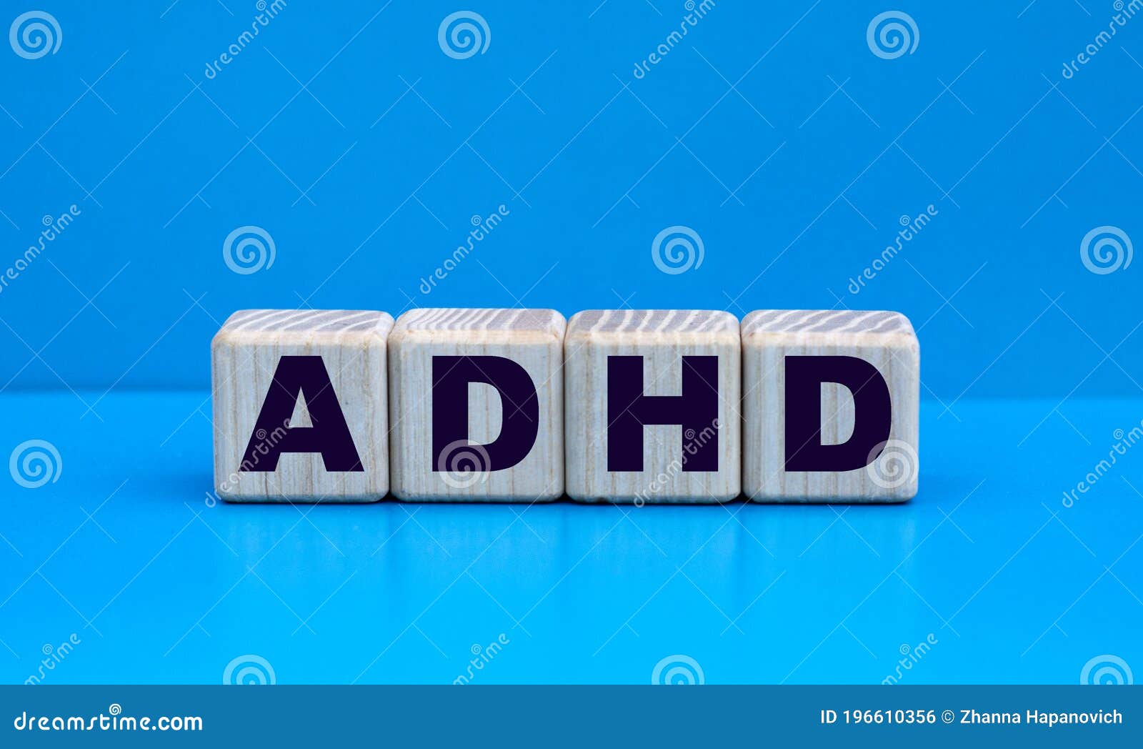 Concept Word ADHD On Cubes On A Blue Background Royalty-Free Stock ...