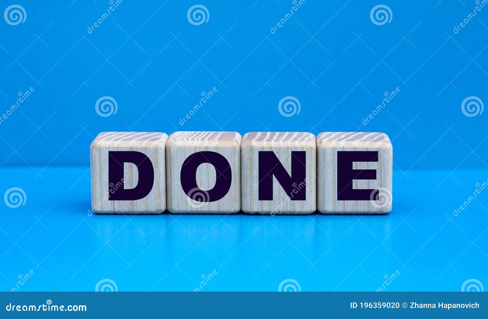 Concept Word DONE on Cubes on a Blue Background Stock Photo - Image of ...