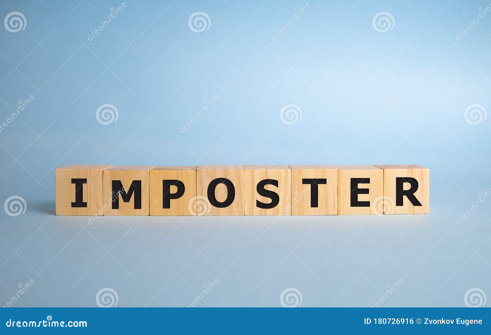 Concept Word Imposter on Cubes on a Blue Background. Stock Photo ...