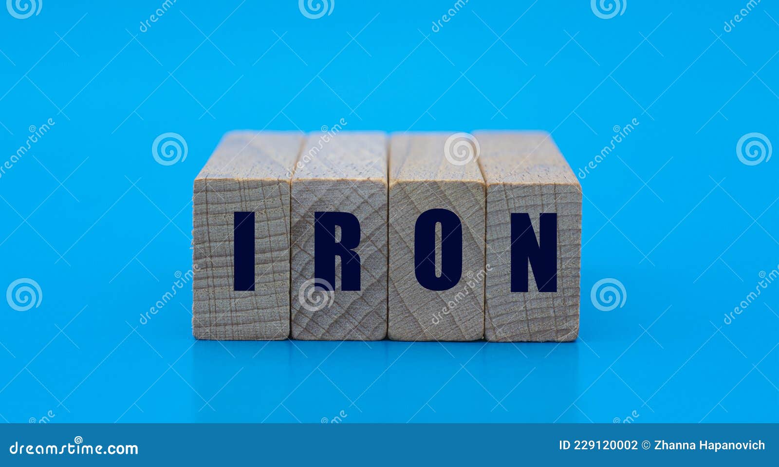 Concept Word IRON on Cubes on a Blue Background Stock Photo - Image of ...