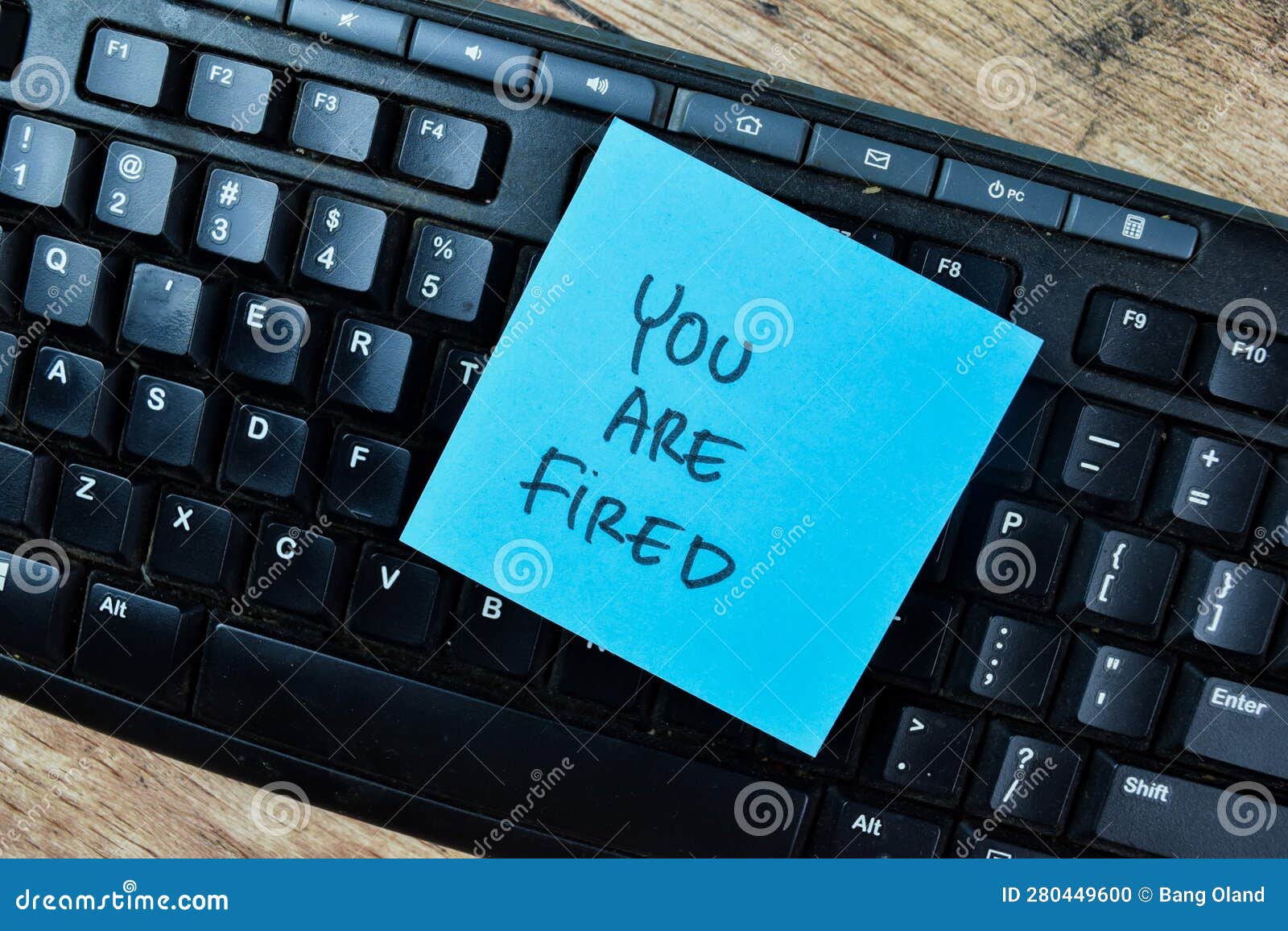 Concept of You are Fired Write on Sticky Notes Isolated on Wooden Table ...