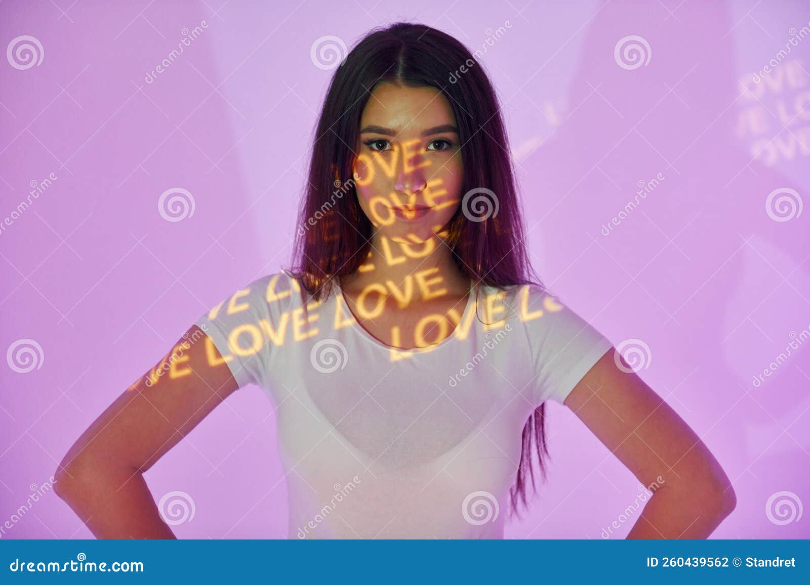 Conception of Love. Beautiful Young Woman is in Projector Neon Lights ...