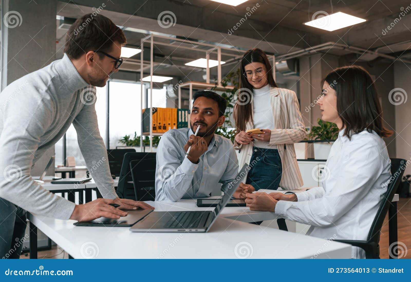 Conception of Teamwork. Four People are in the Office Together Stock ...