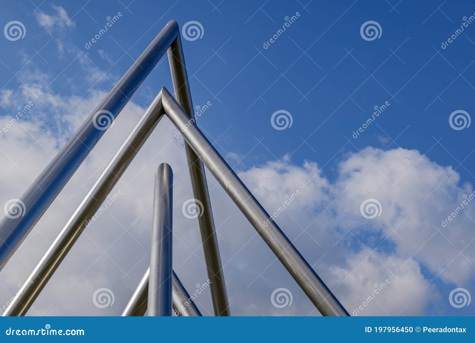 Triangular Metal Chrome Pipes Against Deep Blue Sky. Stock Photo ...