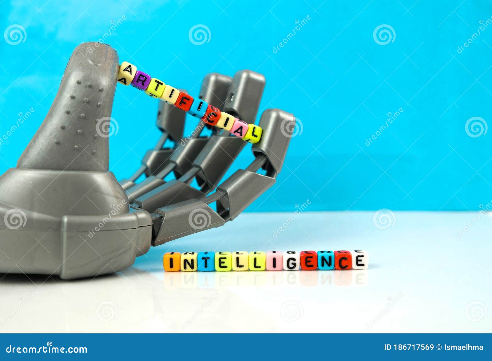 Robotic Claw Hand Grabbing Arranged Alphabet Beads Over Reflective ...