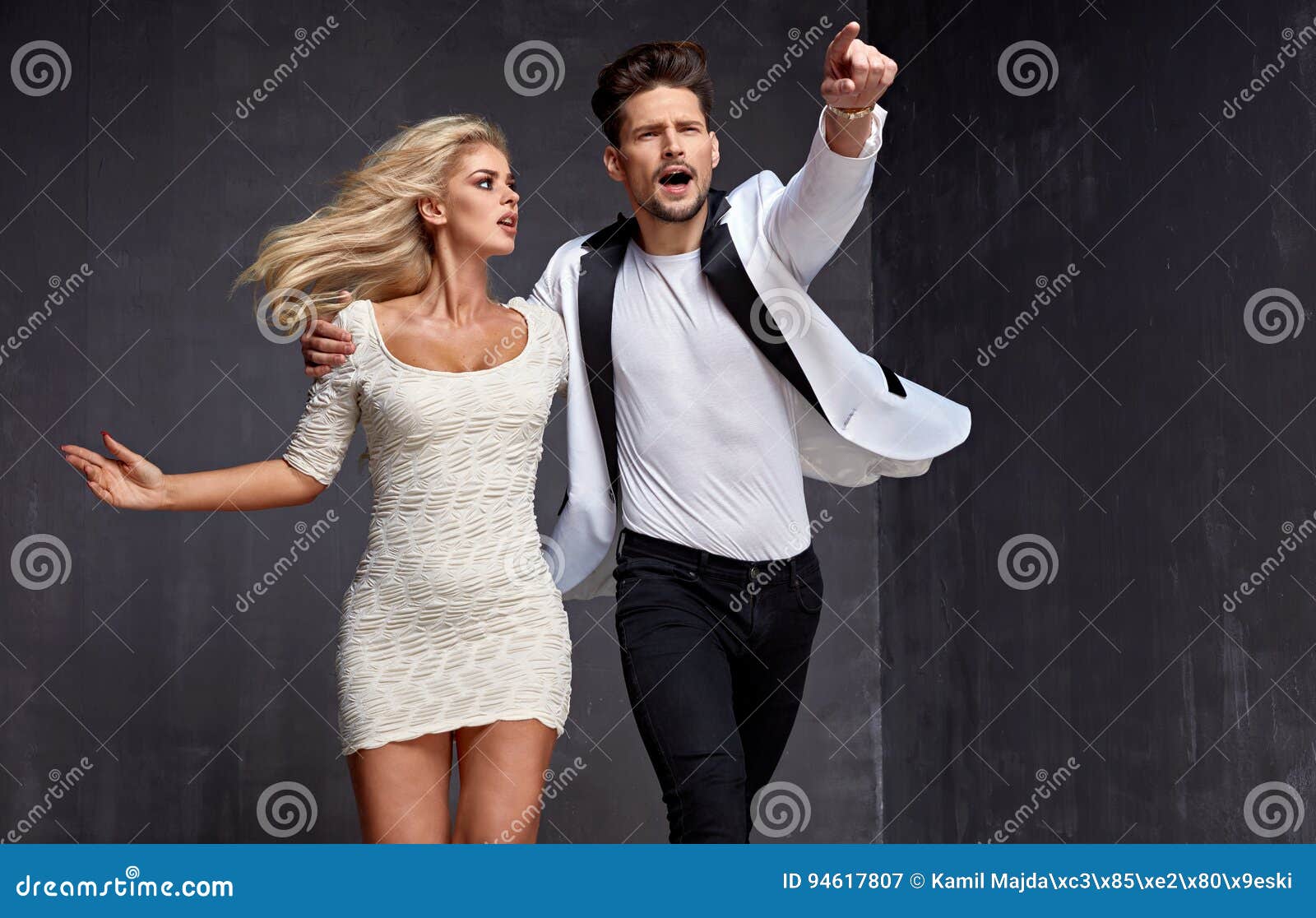 Conceptual Image of an Attractive Couple Chasing Somebody Stock Image ...