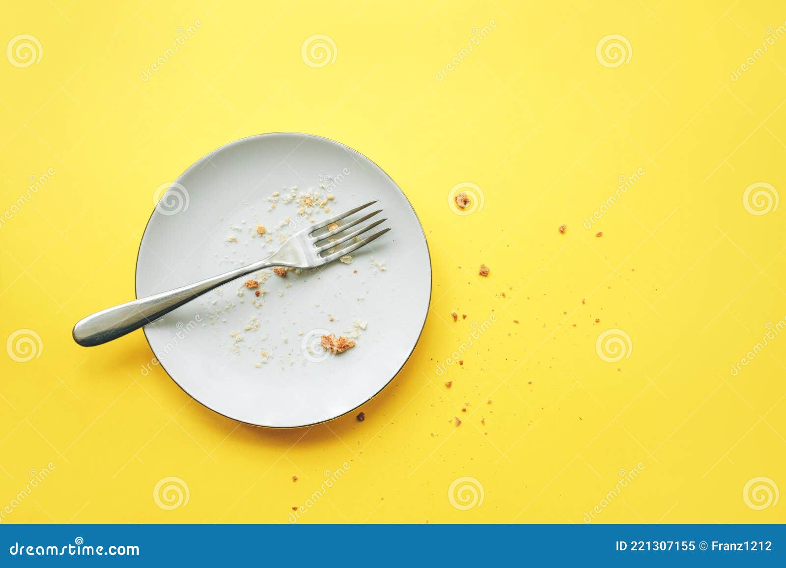 Empty Plate with Crumbs and Fork on it on Yellow Background. Stock ...