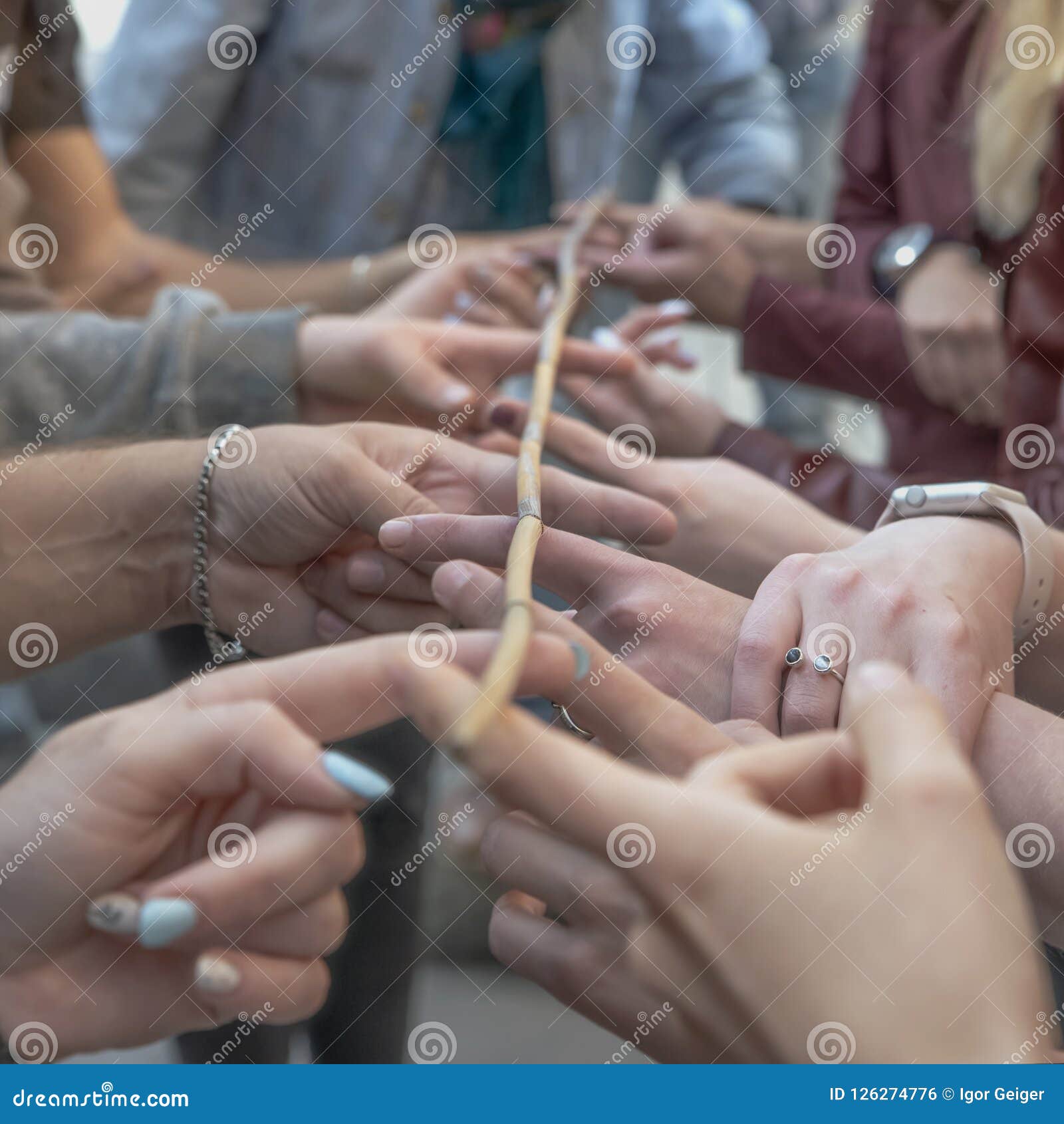 Conceptual Image of Teamwork, a Group of People Holding Sticks H Stock ...