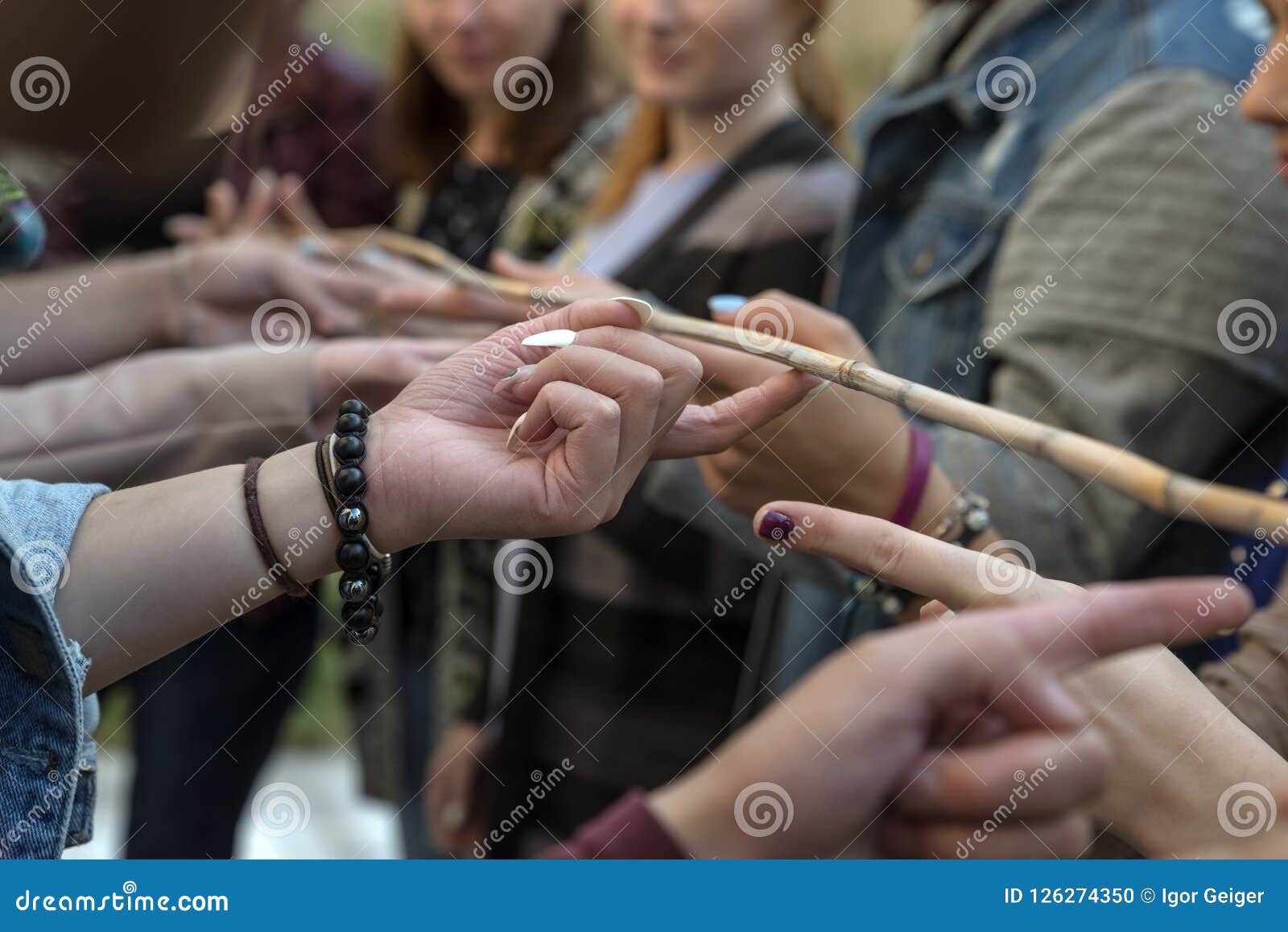 Conceptual Image of Teamwork, a Group of People Holding Sticks H Stock ...