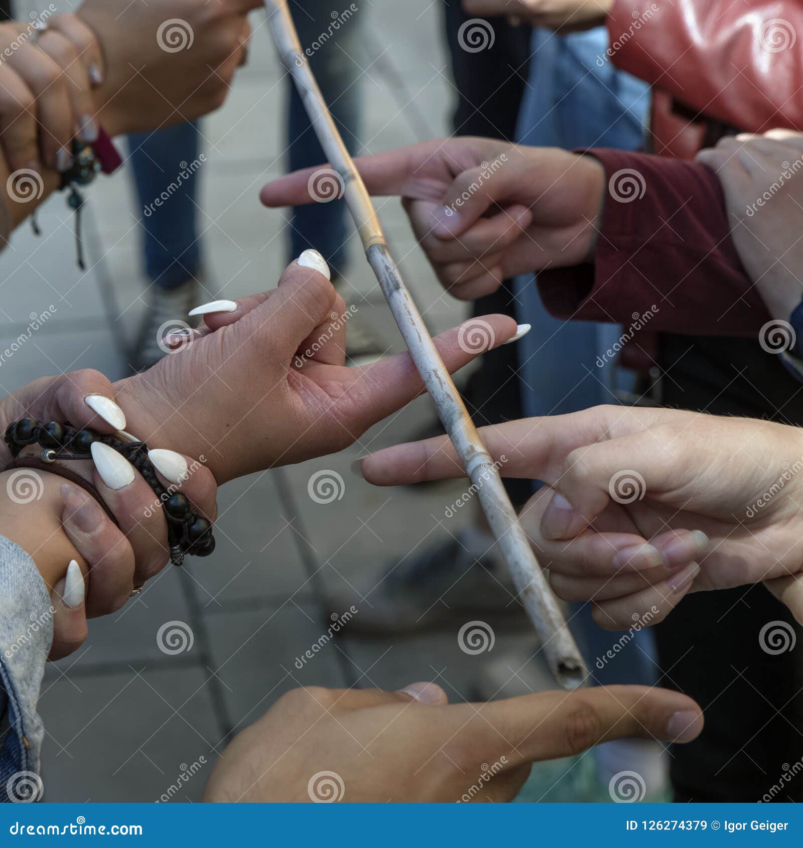 Conceptual Image of Teamwork, a Group of People Holding Sticks H Stock ...