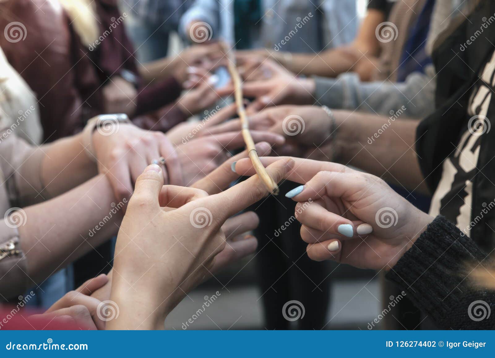 Conceptual Image of Teamwork, a Group of People Holding Sticks H Stock ...