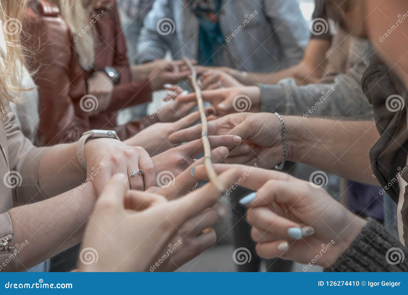 Conceptual Image of Teamwork, a Group of People Holding Sticks H Stock ...