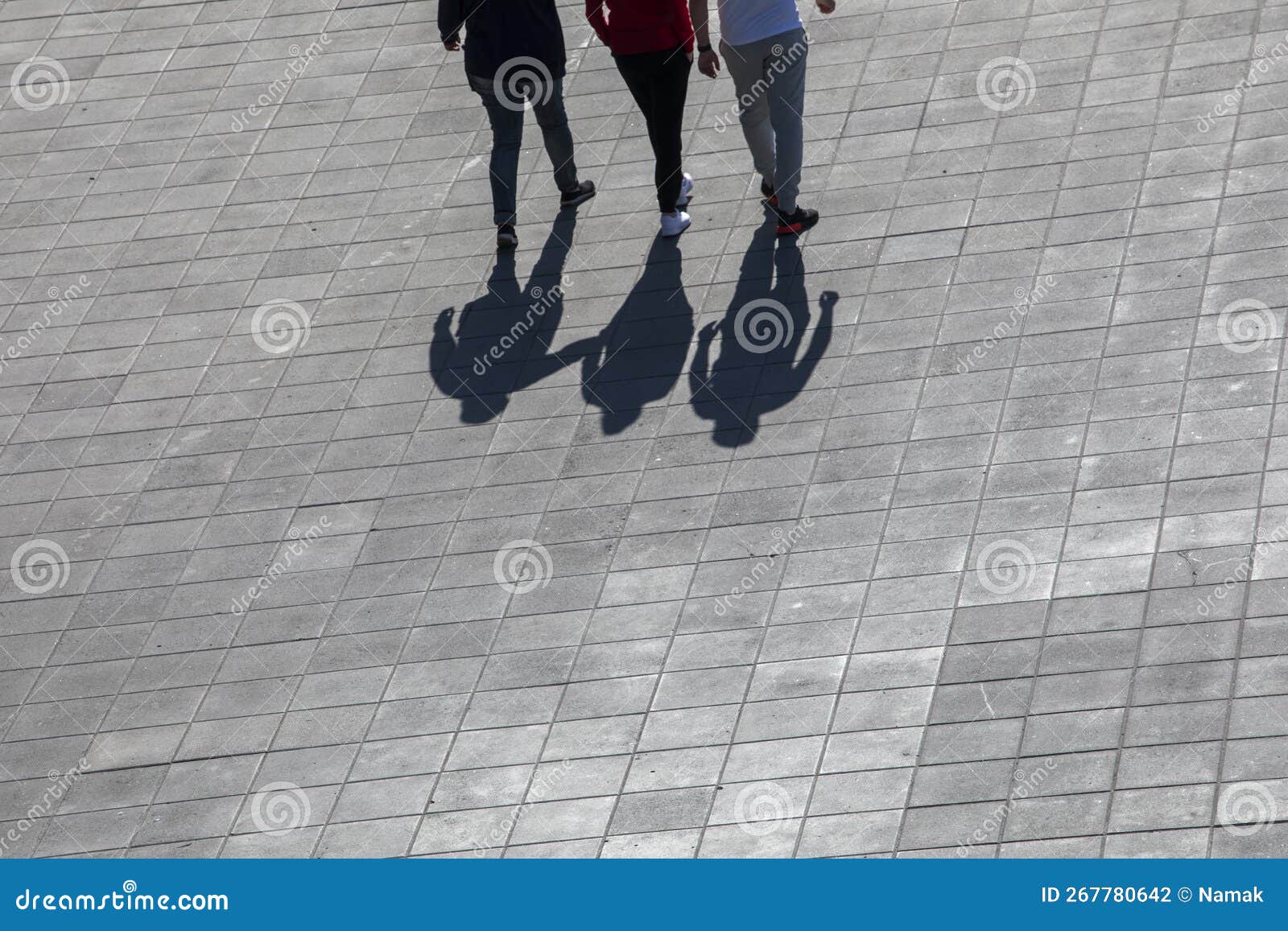 Conceptual Photography Shadow of Three Guys on a Pavement, Top View ...