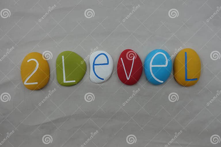 Second Level Text Composed with Multi Colored Stones Over White Sand ...