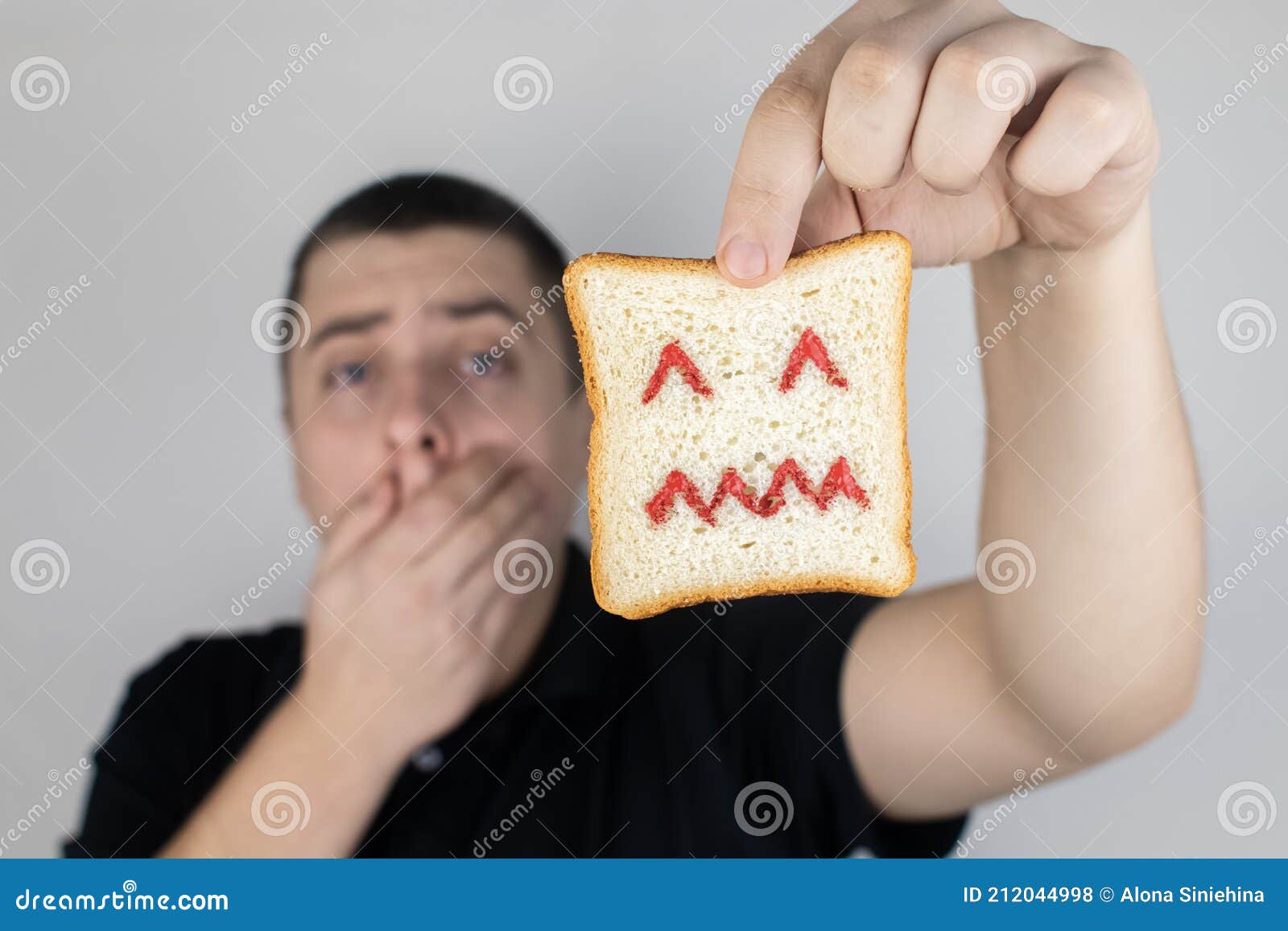 Conceptually About Gluten Intolerance. The Man Holds In His Hand A ...