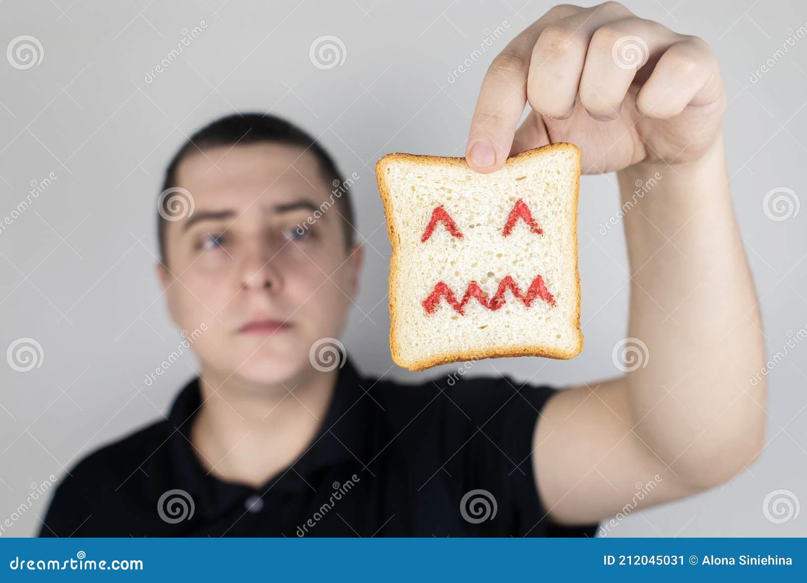 Conceptually About Gluten Intolerance. The Man Holds In His Hand A ...