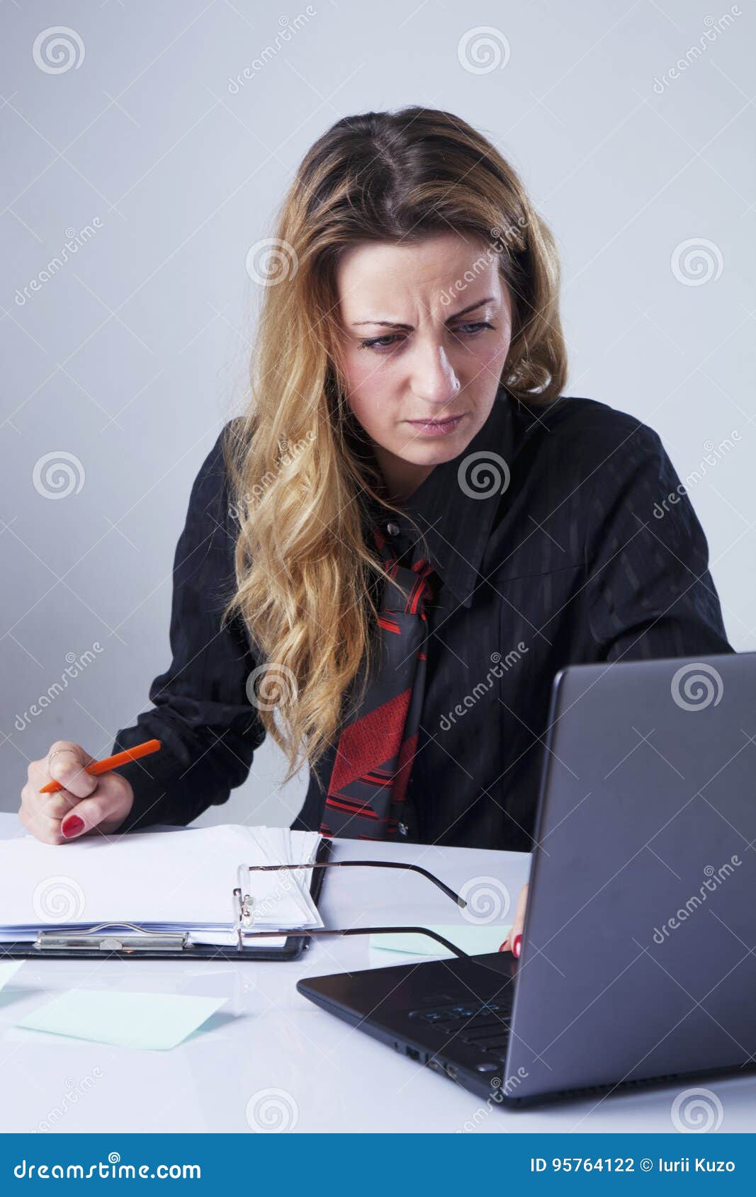 Concerned Beautiful Businesswoman Working at a Computer in the W Stock ...