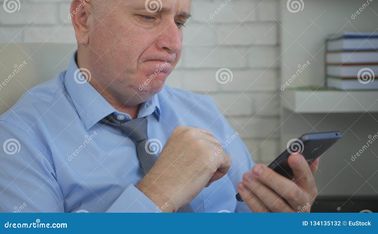 Concerned Businessman Image in Office Room Using Mobile Phone Stock ...