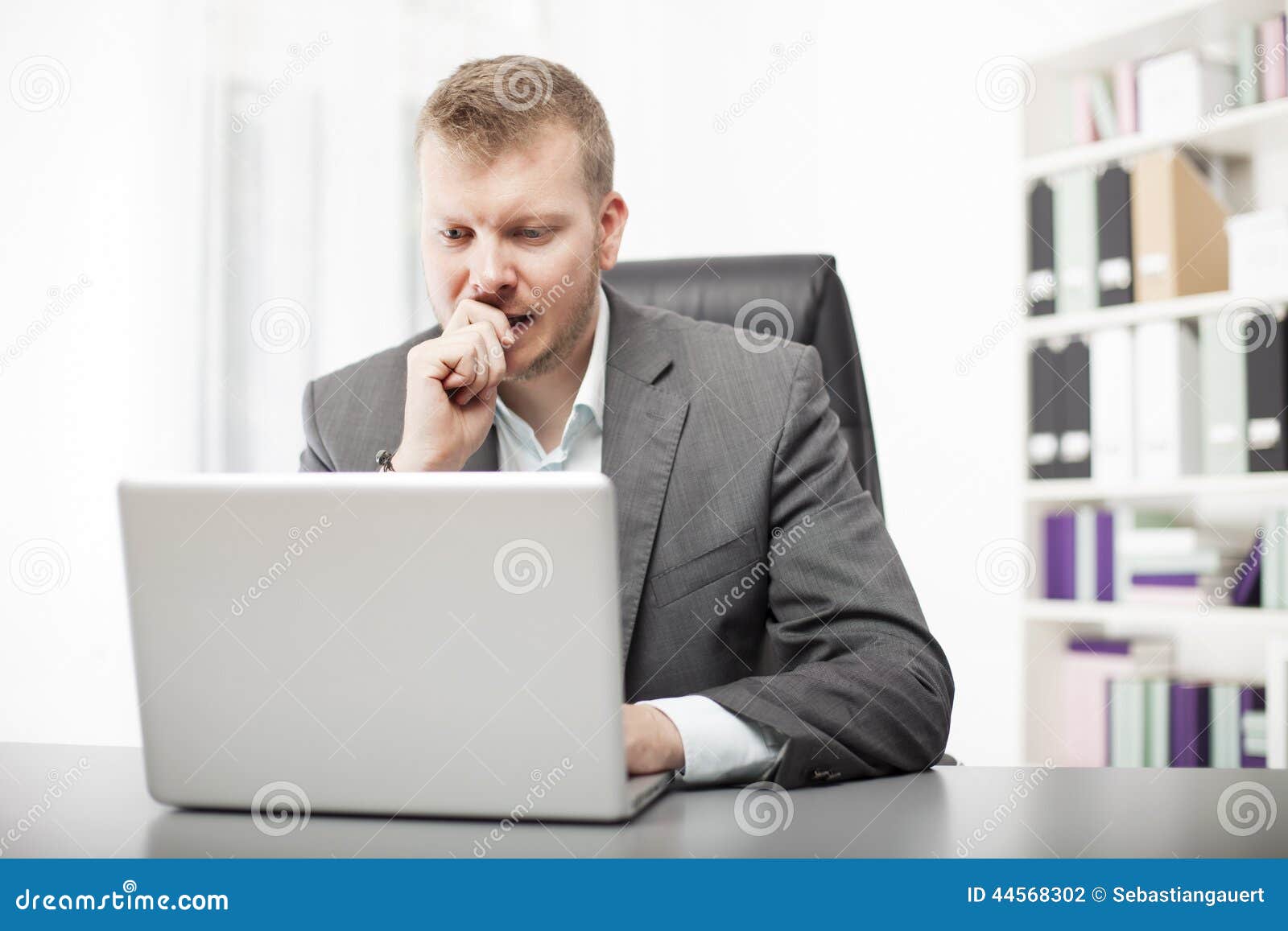 Concerned Businessman Working at His Desk Stock Photo - Image of ...