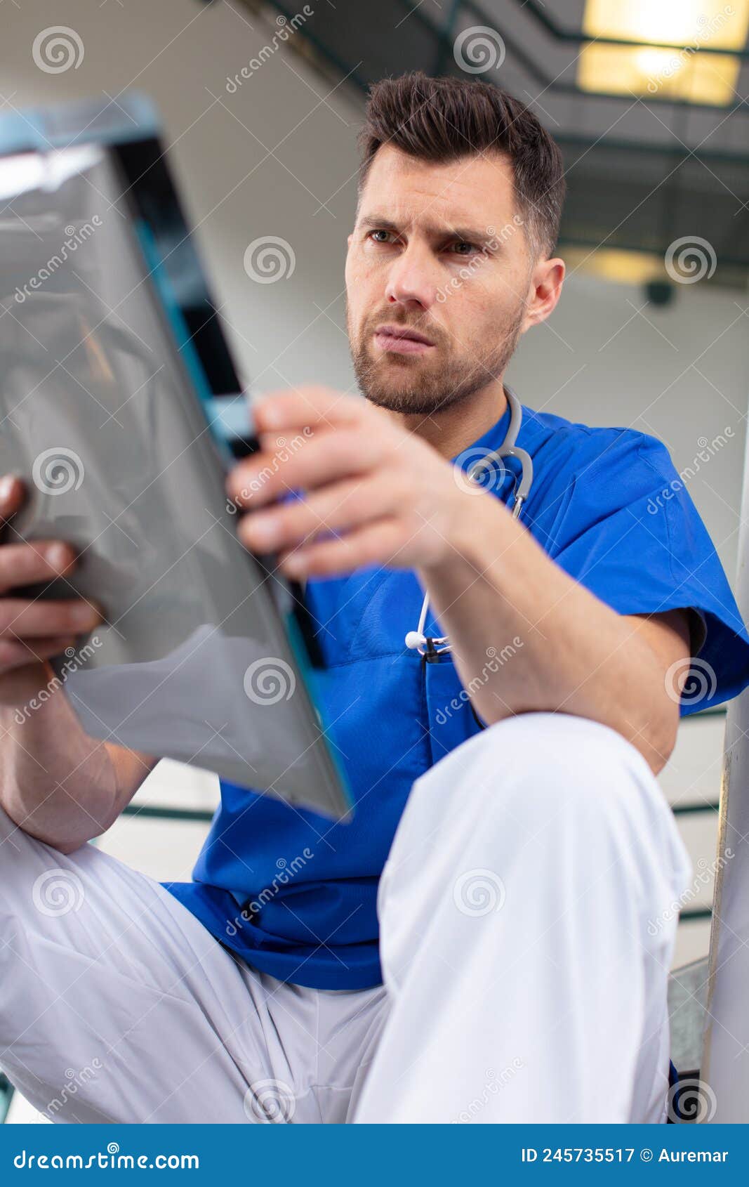Concerned Doctor Sits and Analyses Xrays Stock Image - Image of problem ...