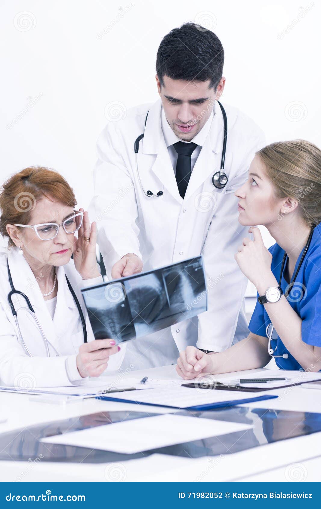 Concerned Doctors Looking at Xray Stock Photo - Image of physician ...