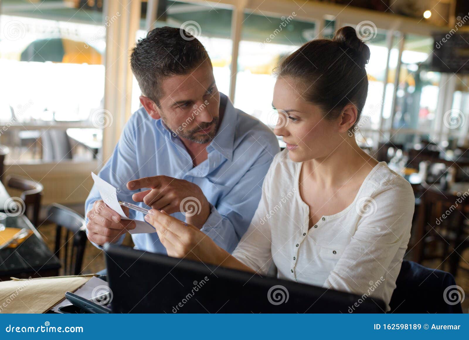 Concerned Female Bar Owner Looking at Laptop Screen Stock Image - Image ...
