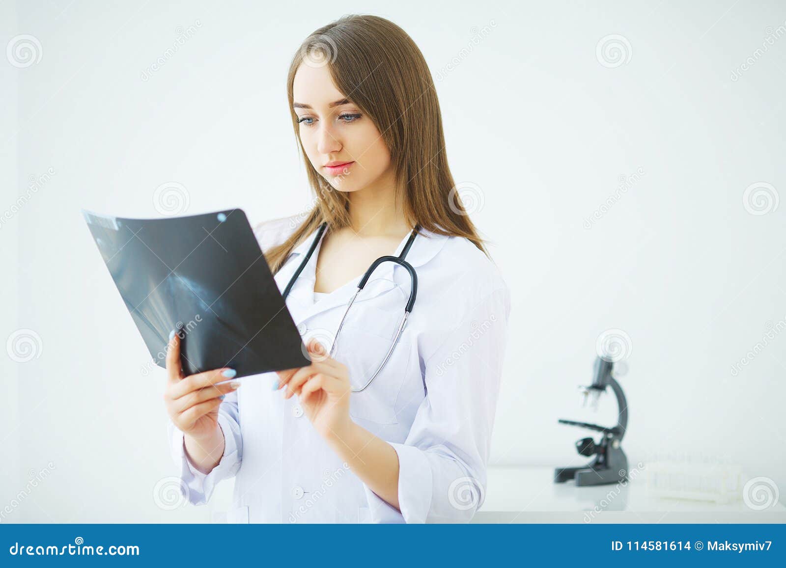 Concerned Male Doctor Looking at X-ray Stock Photo - Image of ...